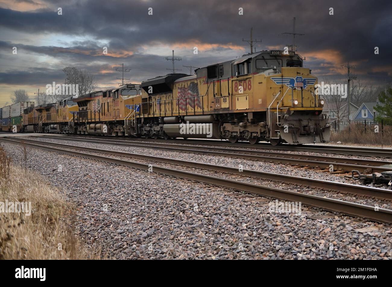 Wheaton, Illinois, USA. Four locomotives lead a Union Pacific intermodal freight train through ...