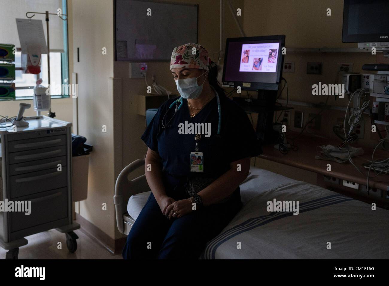 Registered nurse Merit Hayden-Town is shown in the intensive care unit ...