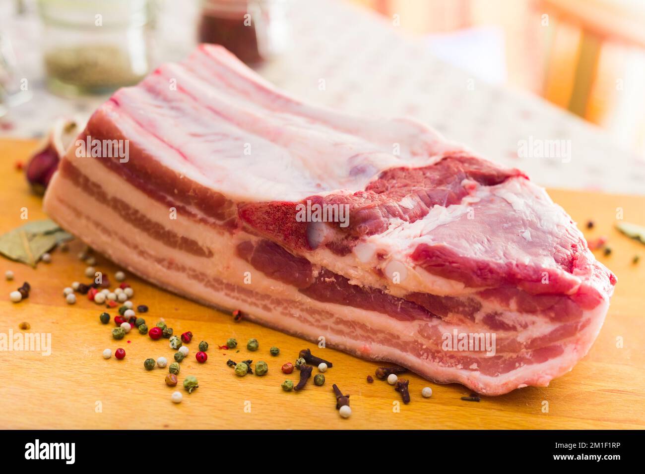 cooking traditional homemade lard with spices. pork belly with layer on ...