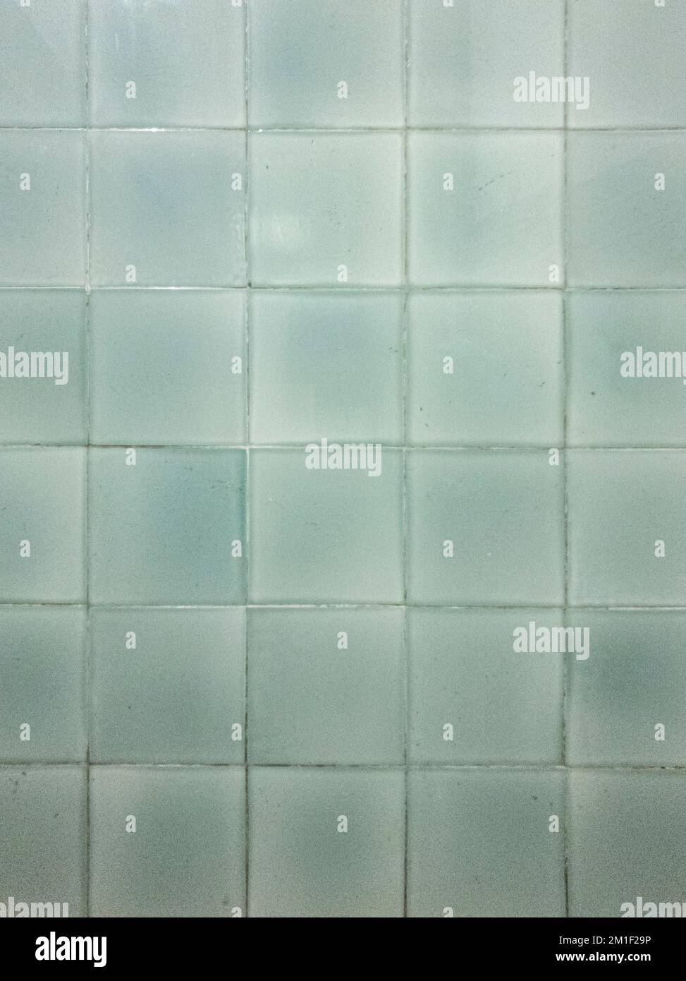 A vertical closeup top view of the wall tiles in light blue color Stock ...