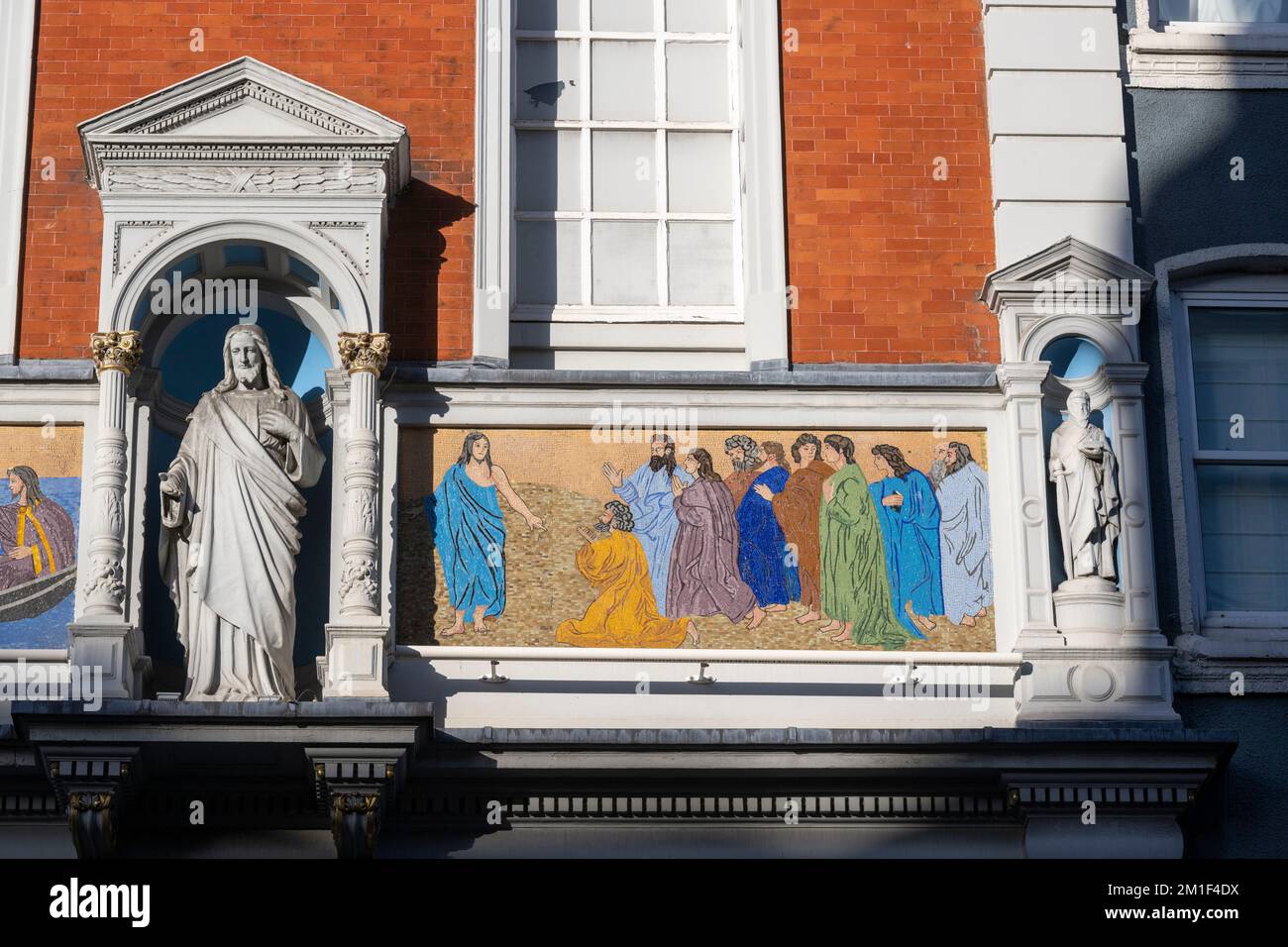 Mosaic and a statue on the exterior Saint Peter's Italian Church in ...