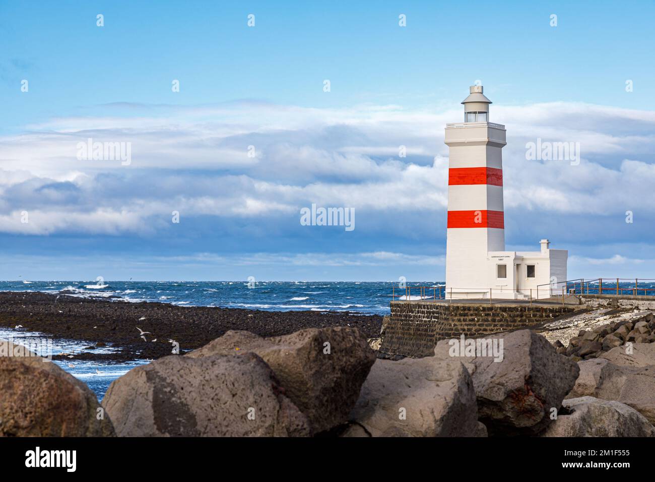 Lighthouse on the coast of Icelandic sea as a part of Atlantic ocean ...