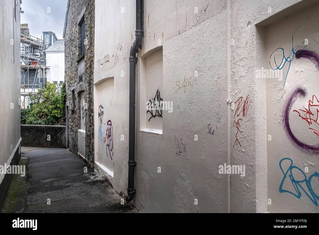Ugly graffiti scrawled over walls in Roberts Ope an old alleyway in ...