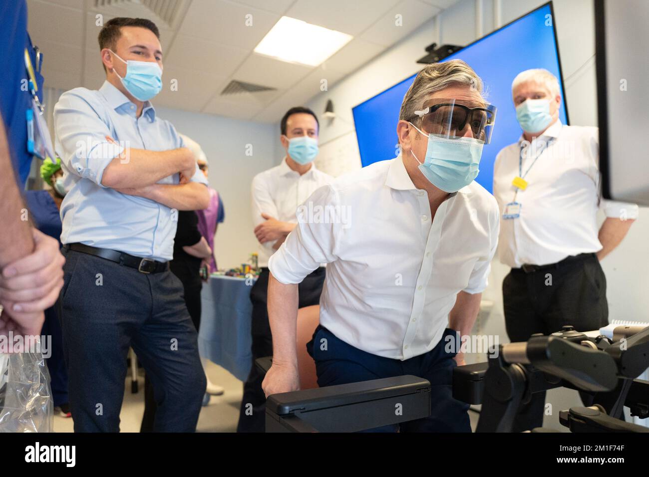 Labour Party leader Sir Keir Starmer (sitting) tries his hand at ...