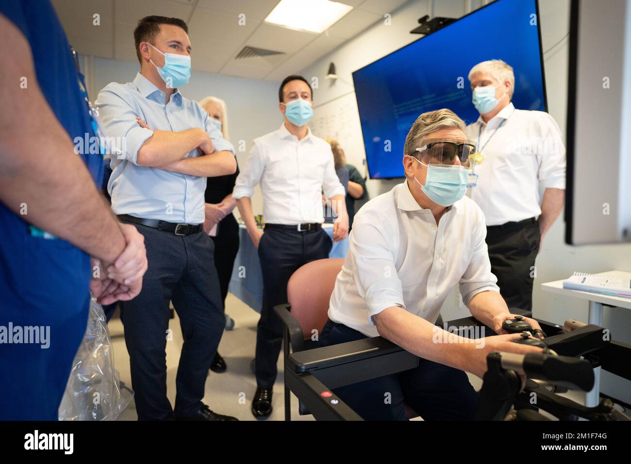 Labour Party leader Sir Keir Starmer (sitting) tries his hand at ...