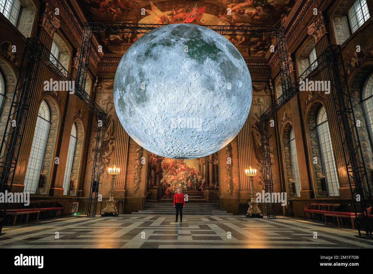 London, UK. 12th Dec, 2022. Staff pose with the installation. Artist ...