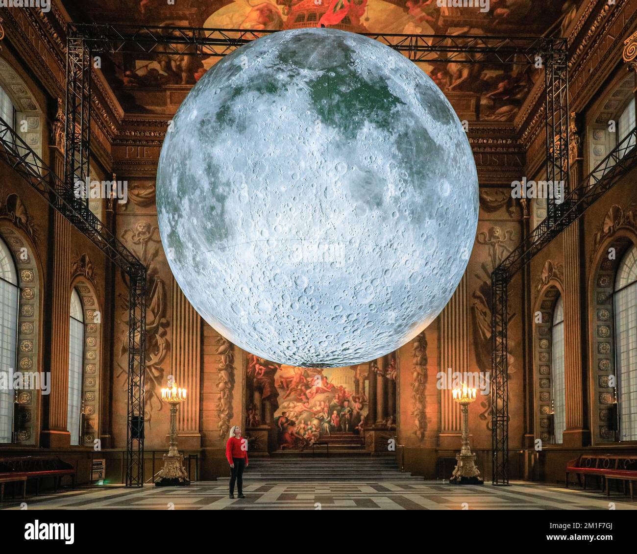 London, UK. 12th Dec, 2022. Staff pose with the installation. Artist ...