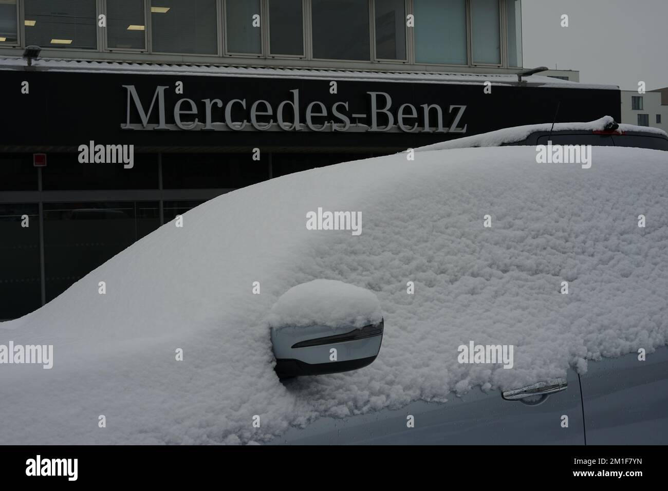 A snow-covered car at Mercedes in Colindale, London, England, U.K Stock ...