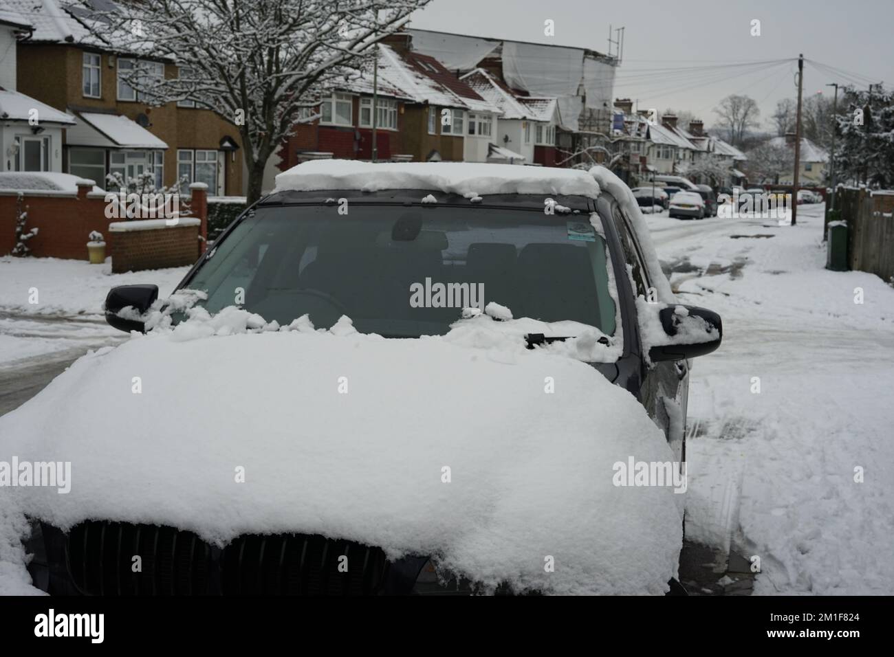 A snow-covered cars in Greenway Gardens, Barnet, Colindale, London ...