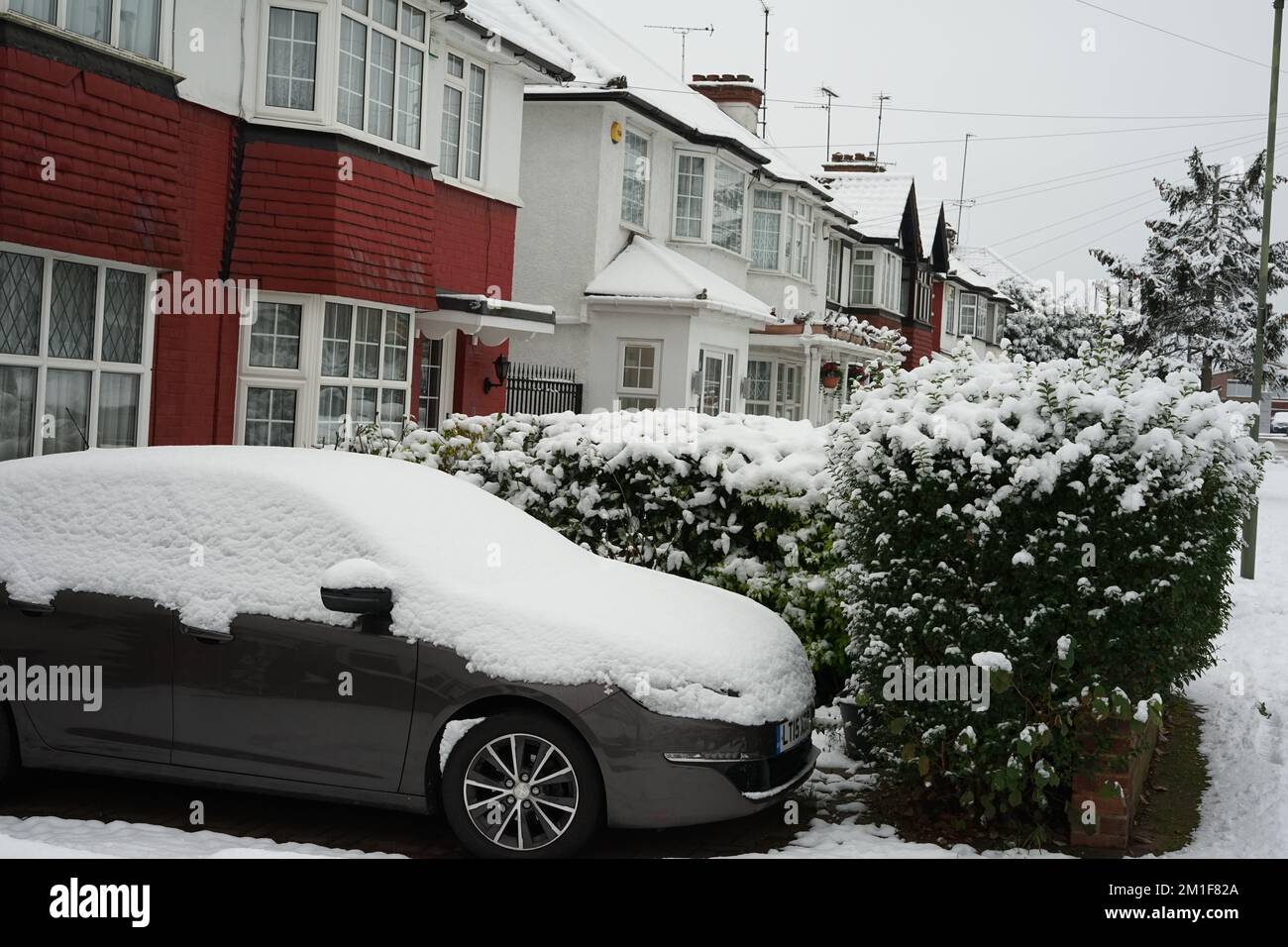 A snow-covered cars in Greenway Gardens, Barnet, Colindale, London ...