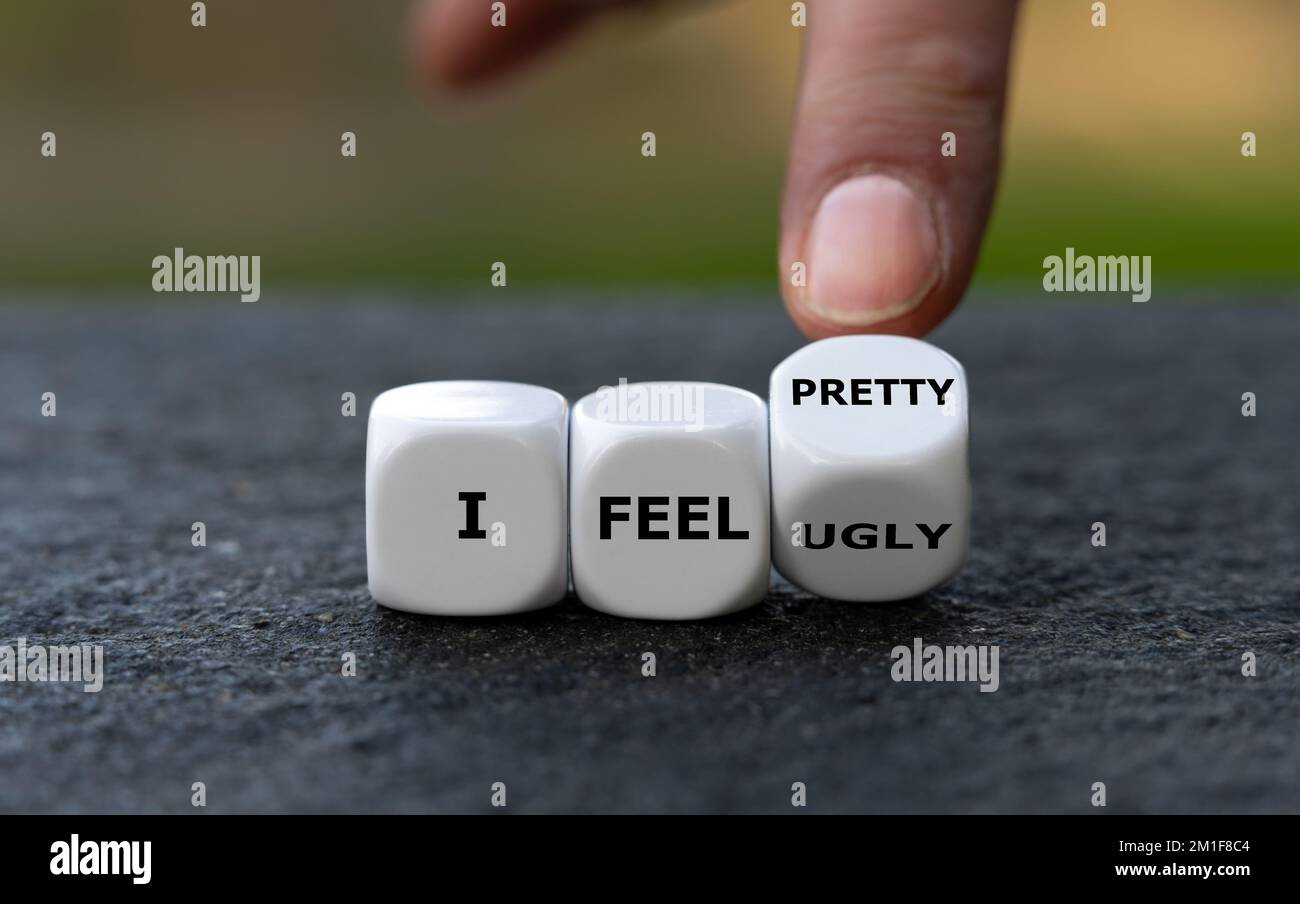 Hand turns dice and changes the expression 'I feel ugly' to 'I feel ...