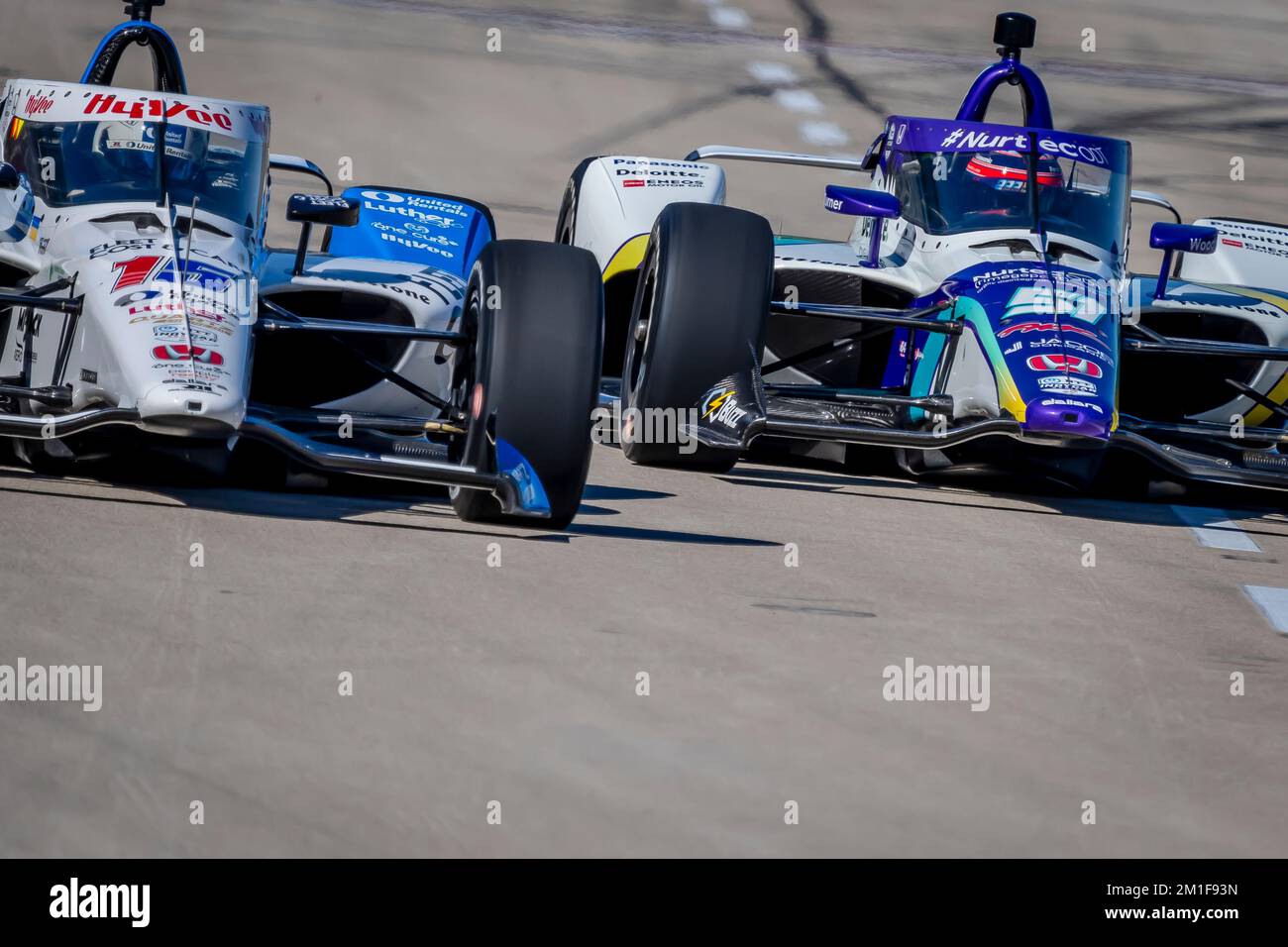TAKUMA SATO (51) of Tokyo, Japan brings his car through the front ...