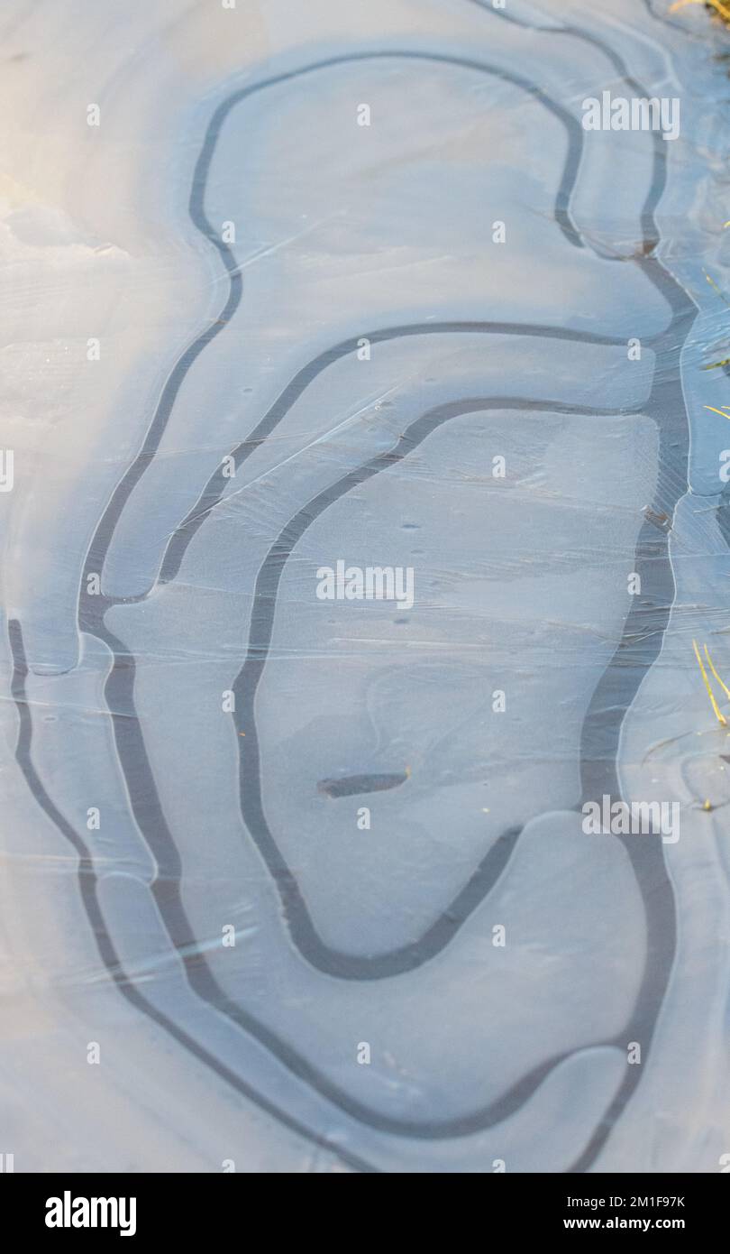 Pattern in frozen puddle Stock Photo - Alamy