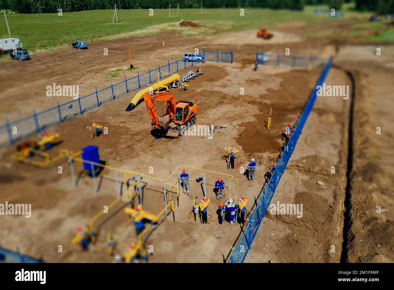 Aerial view excavator and construction workers working on construction ...