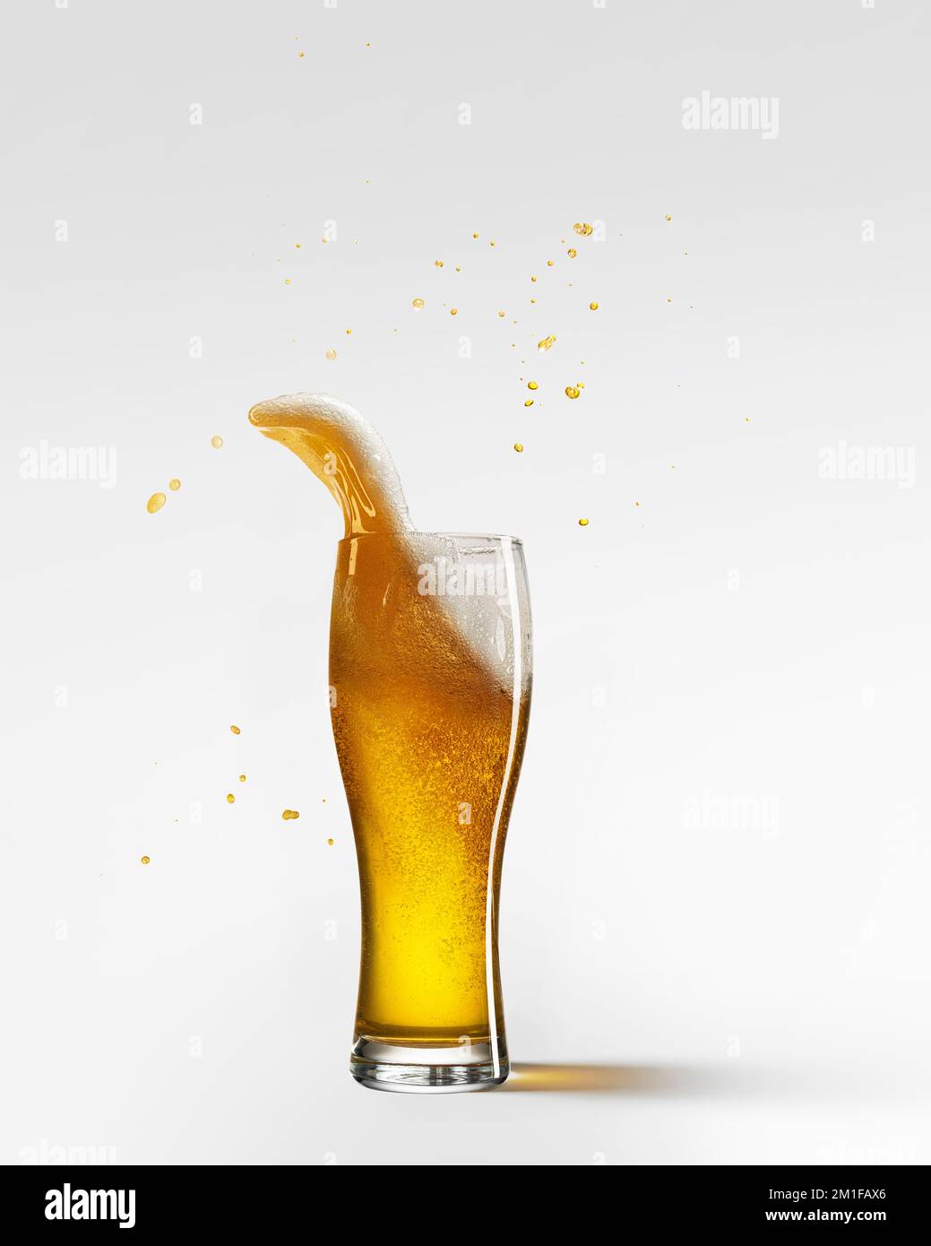 Glass with light, foamy beer isolated over grey background. Lager beer ...