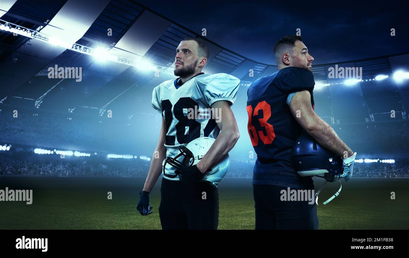 Two american football player in uniform standing back to back in ...