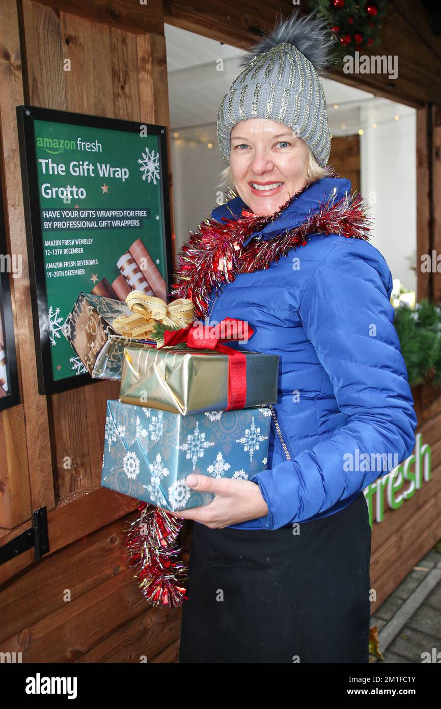 EDITORIAL USE ONLY Professional gift wrapper, Jane Means wraps presents ...