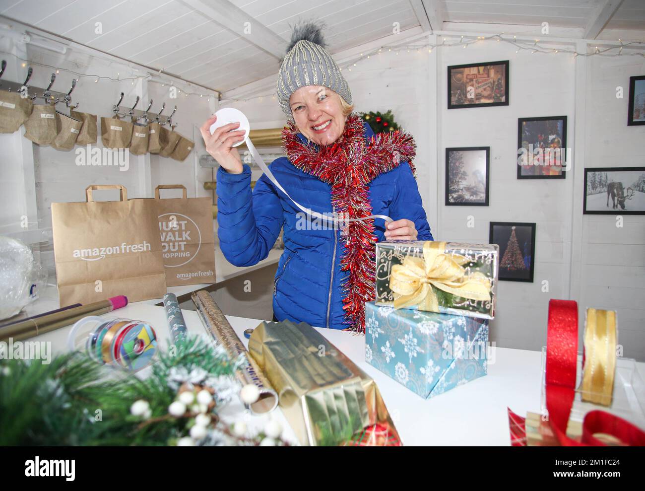 EDITORIAL USE ONLY Professional gift wrapper, Jane Means wraps presents ...