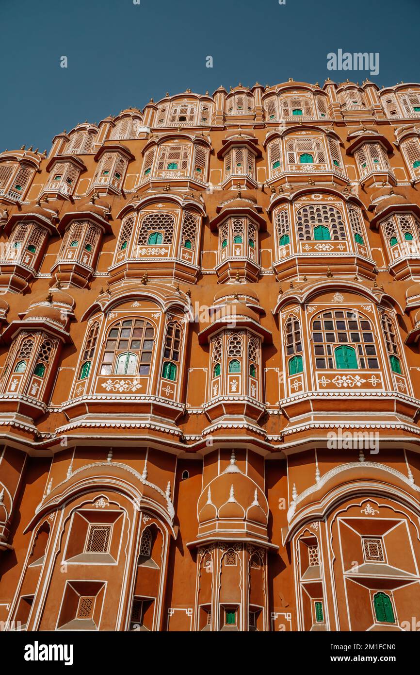 A vertical, low-angle shot of a mesmerizing exterior of The Hawa Mahal ...