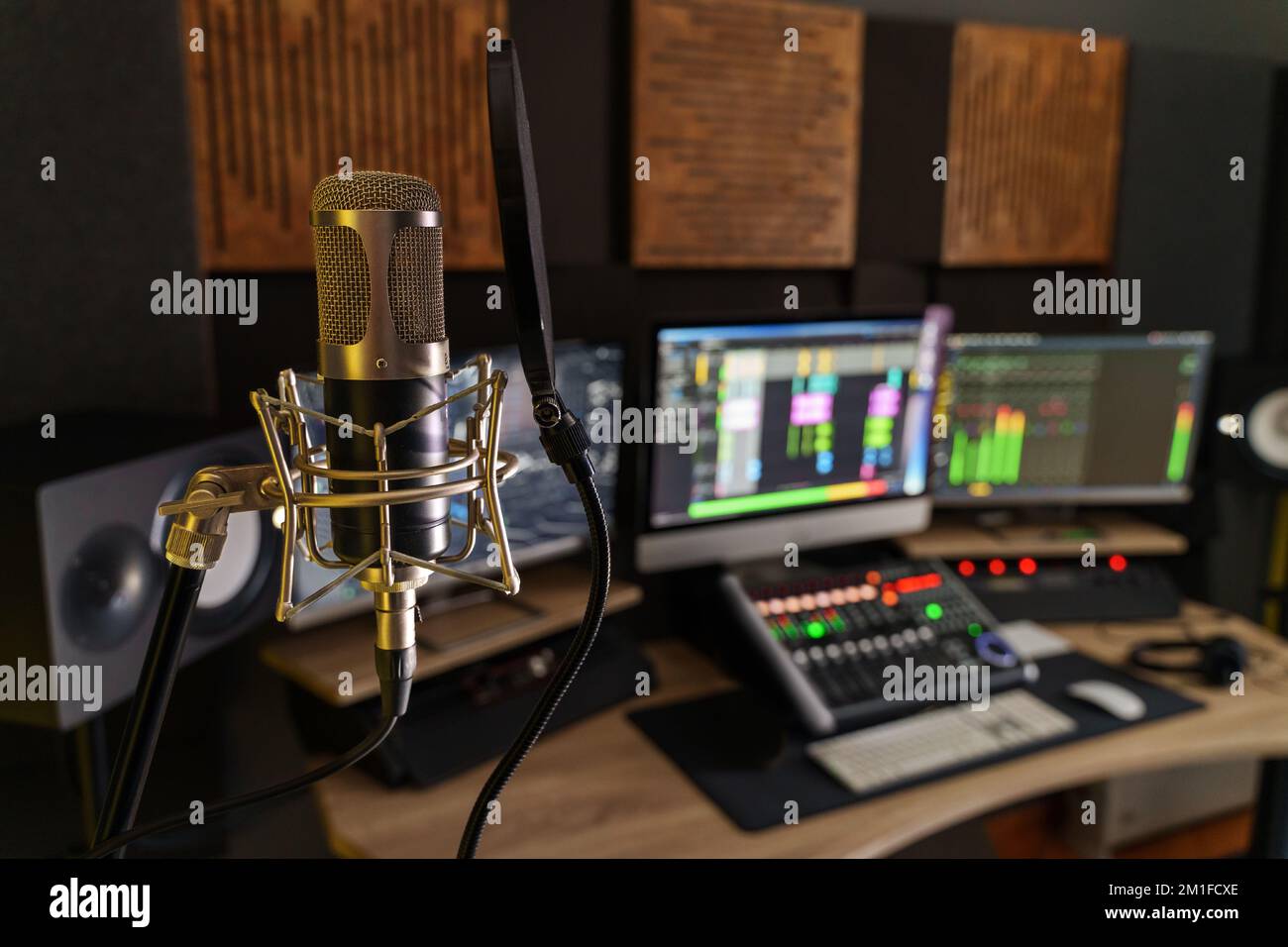 Professional microphone in a small music sound production studio ...