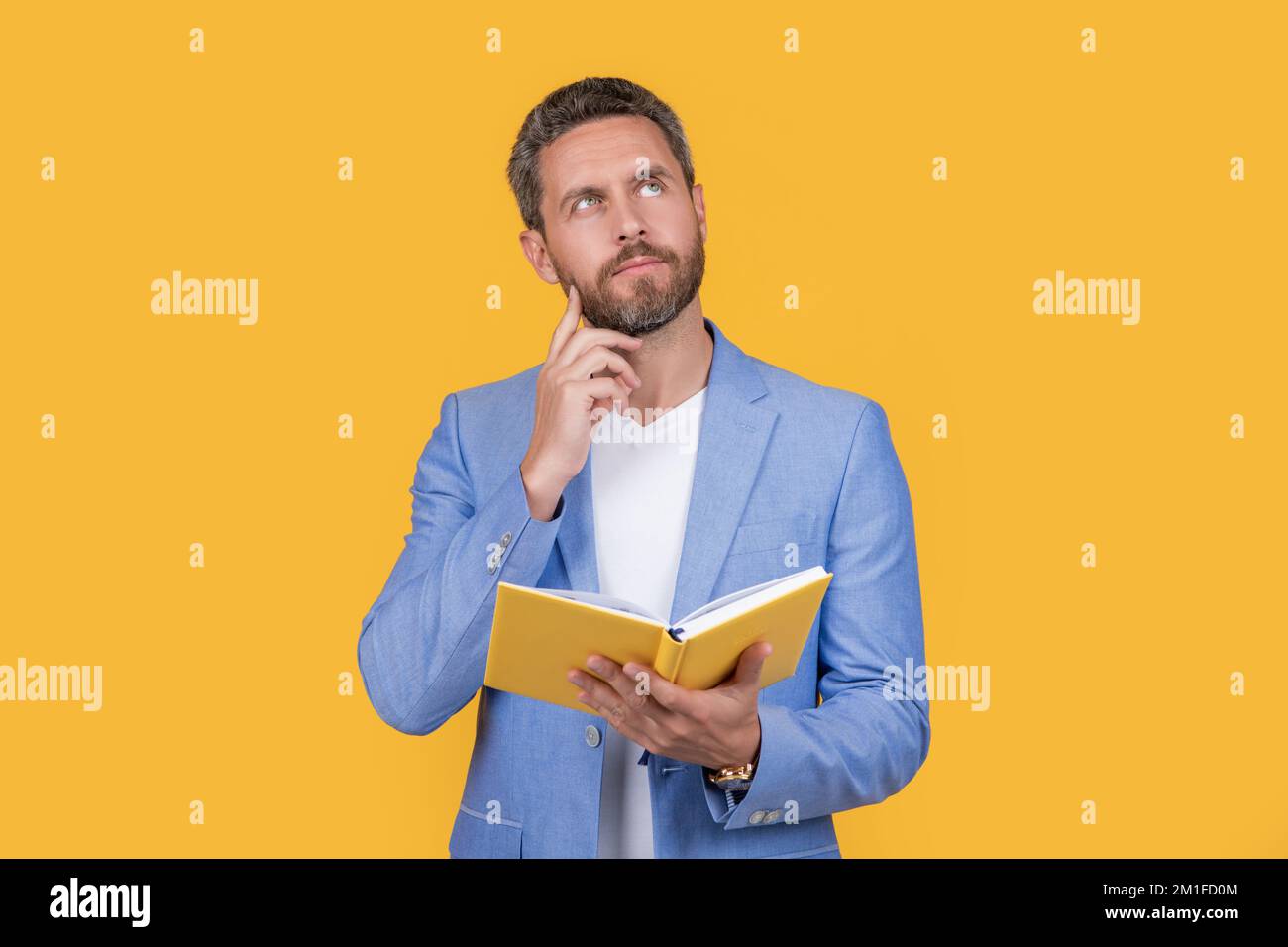 studio shot of thinking man reader reading book. photo of man reader ...