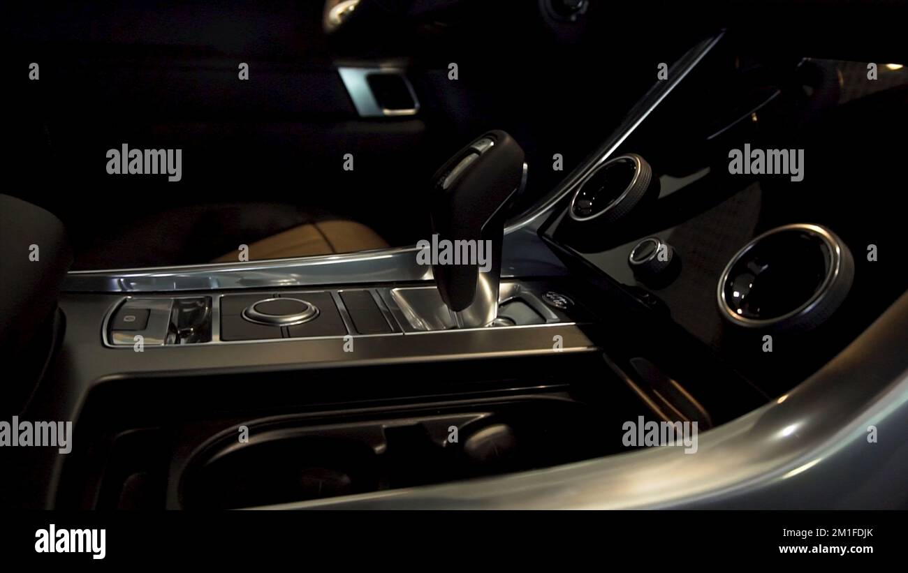 Close up for automatic gear stick of a modern car, car interior details ...