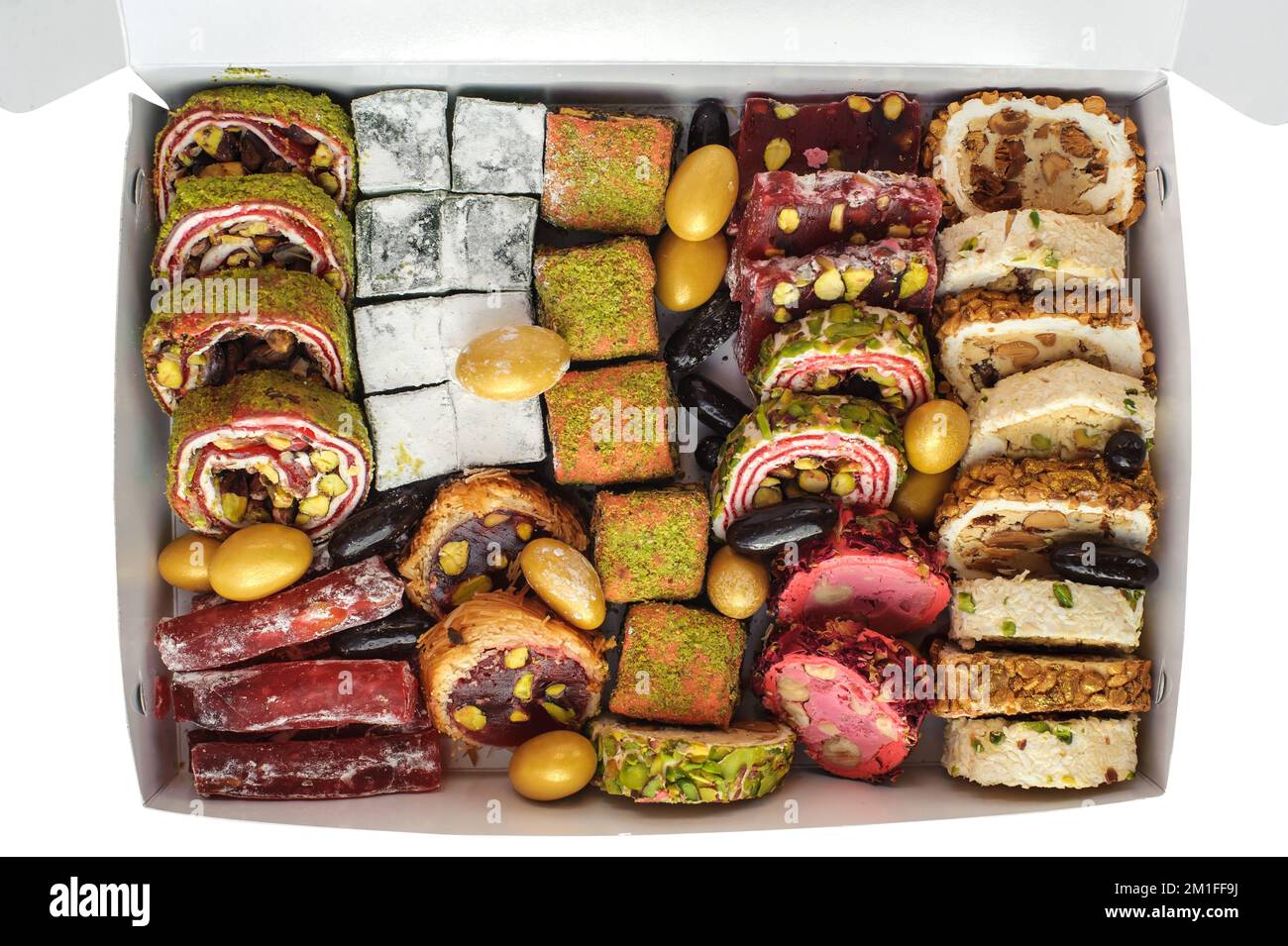 Mix of various pieces of traditional turkish delight in delivery box ...