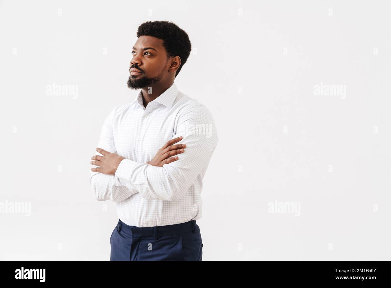Black mid man wearing shirt posing and looking aside isolated over ...