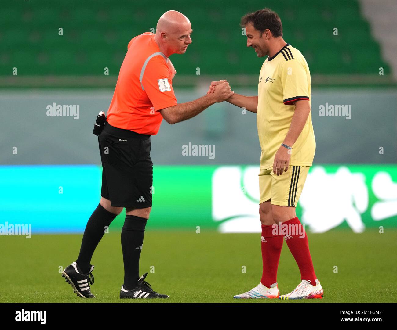 FIFA President and referee Gianni Infantino shakes hands with Team B's ...