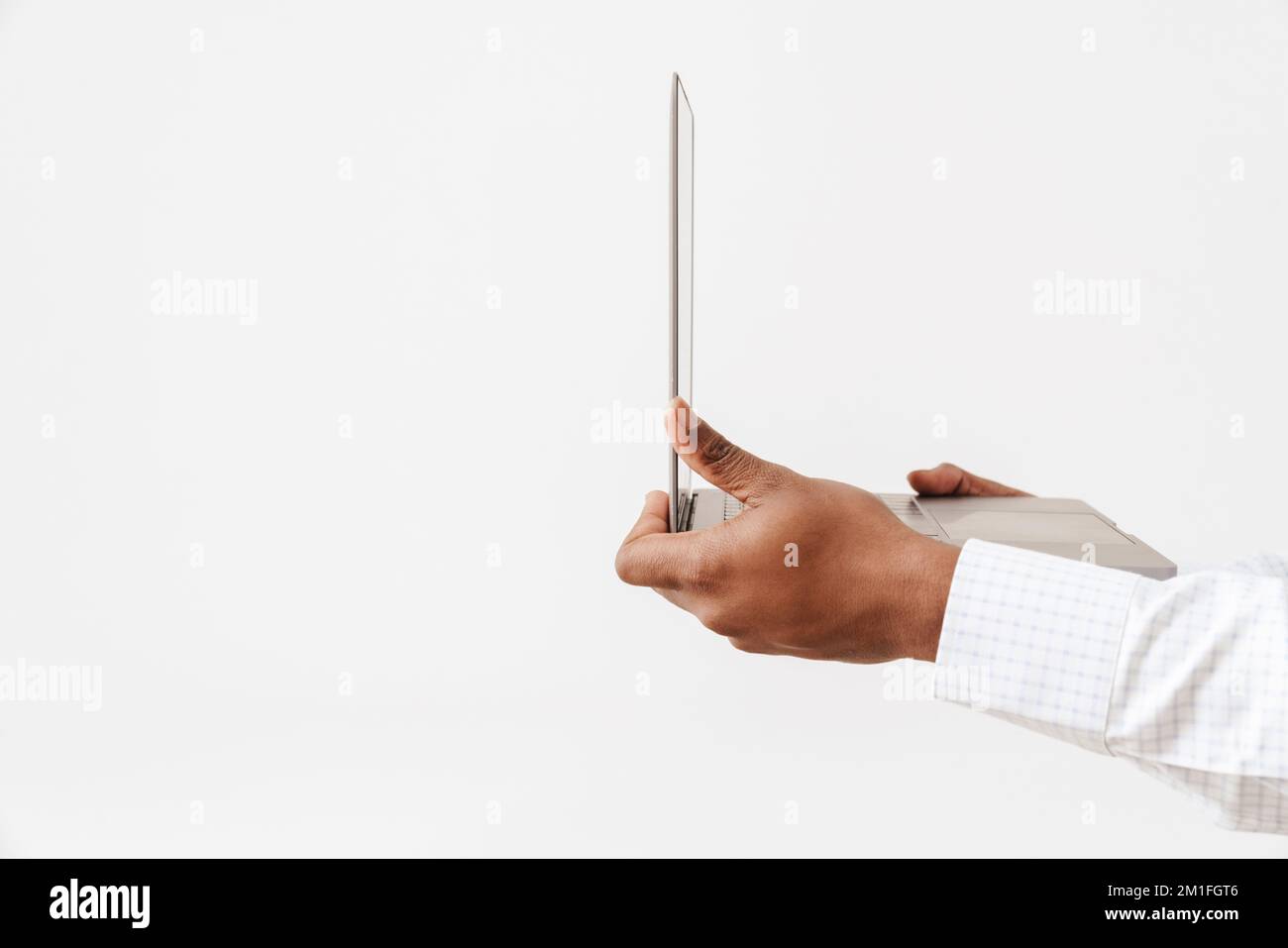 Photo of black man's hand with laptop isolated over white background ...