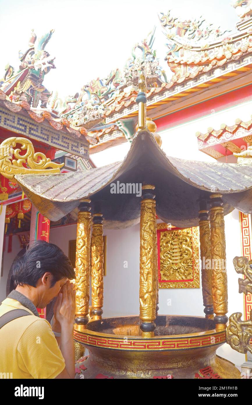 Visitor Paying Respect after Placing Incense Sticks in the Burner at ...