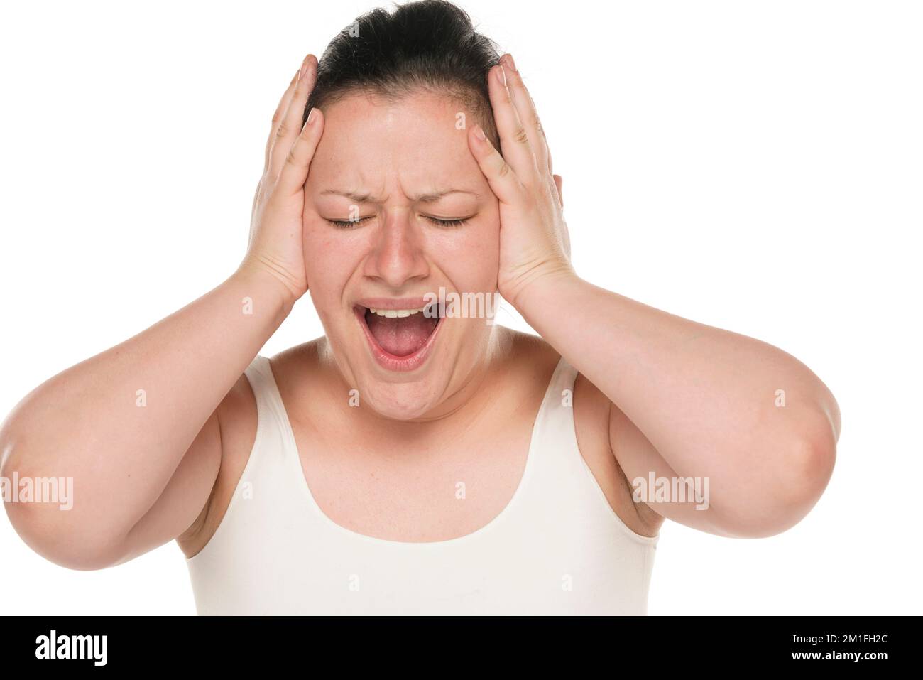 Shocked Panic Young Chubby Caucasian Woman Over White Background Holding Hands On Head And