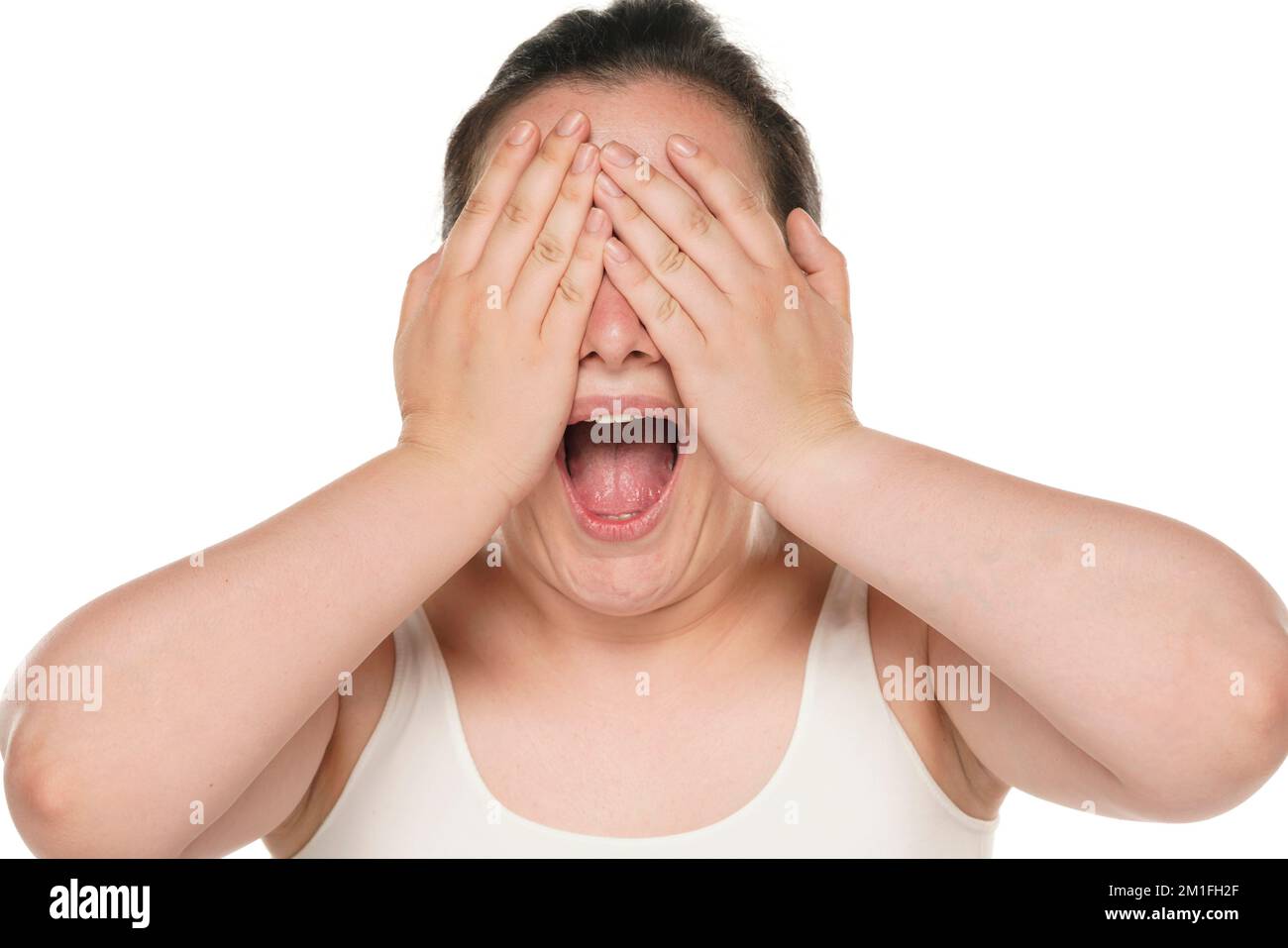 Afraid Panic Young Chubby Woman Over White Background Holding Hands Over Her Eyes And Screaming