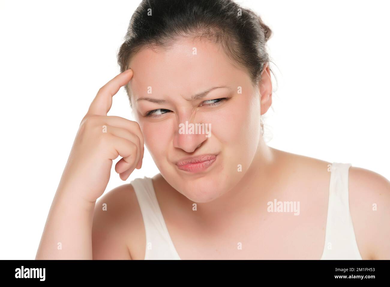 Headshot of chubby woman doing hard thinking pose withe her finger ...