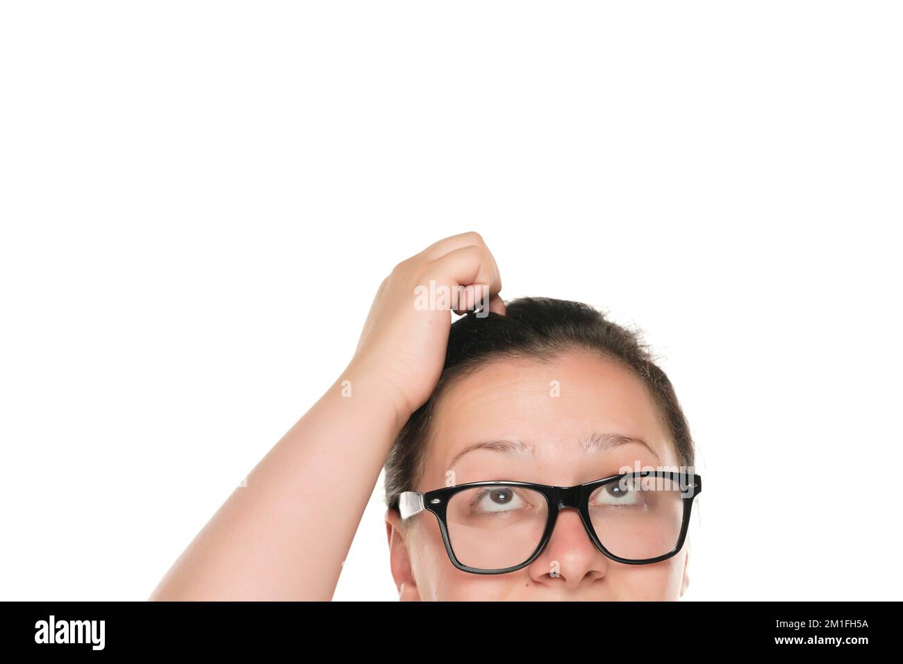 half portrait of a young chubby woman with glasses looking up and ...