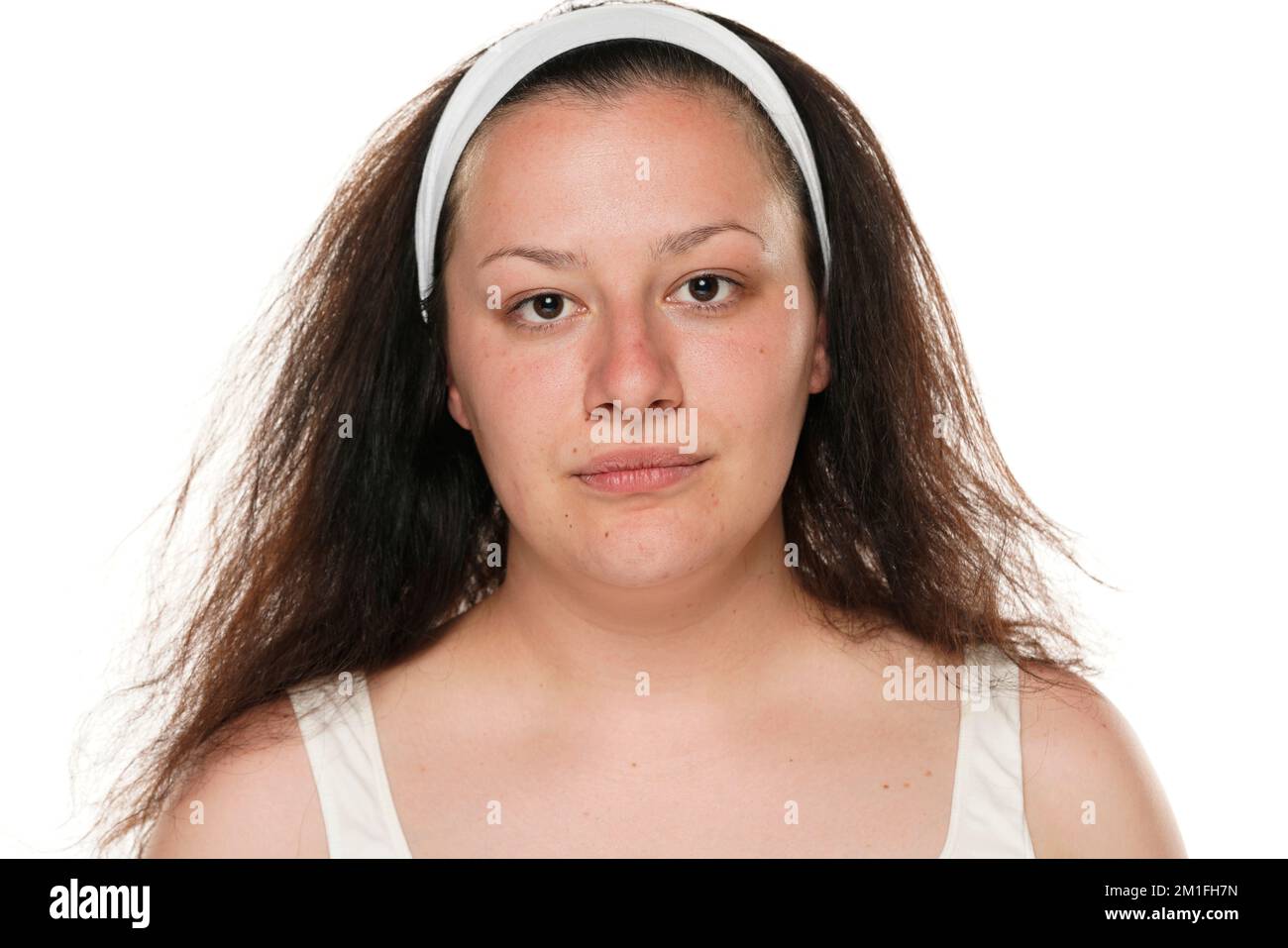 Headshot of chubby woman without makeup and with headband. Isolated on ...