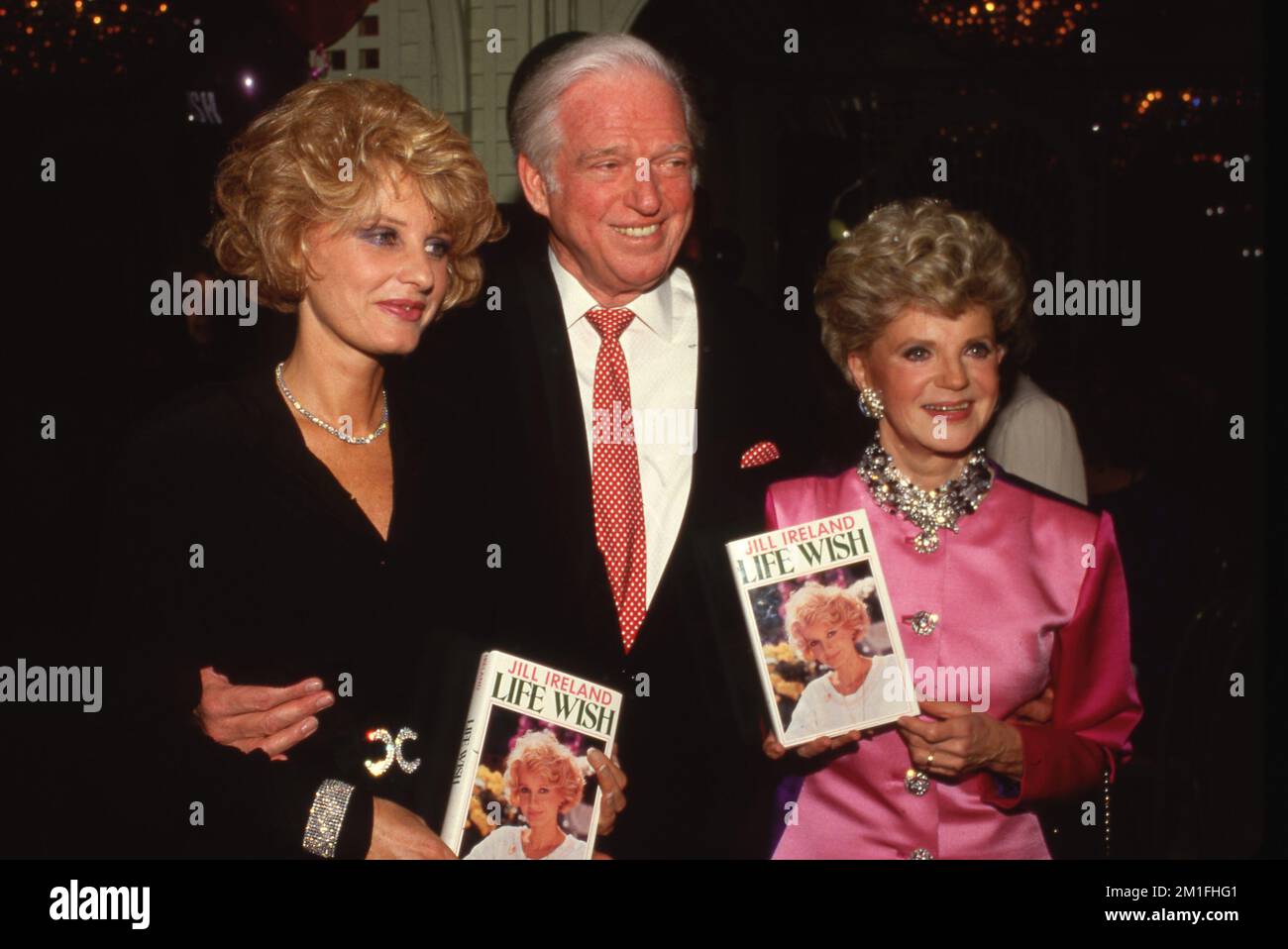 Jill Ireland with Sidney Sheldon and Judith Krantz at the party ...