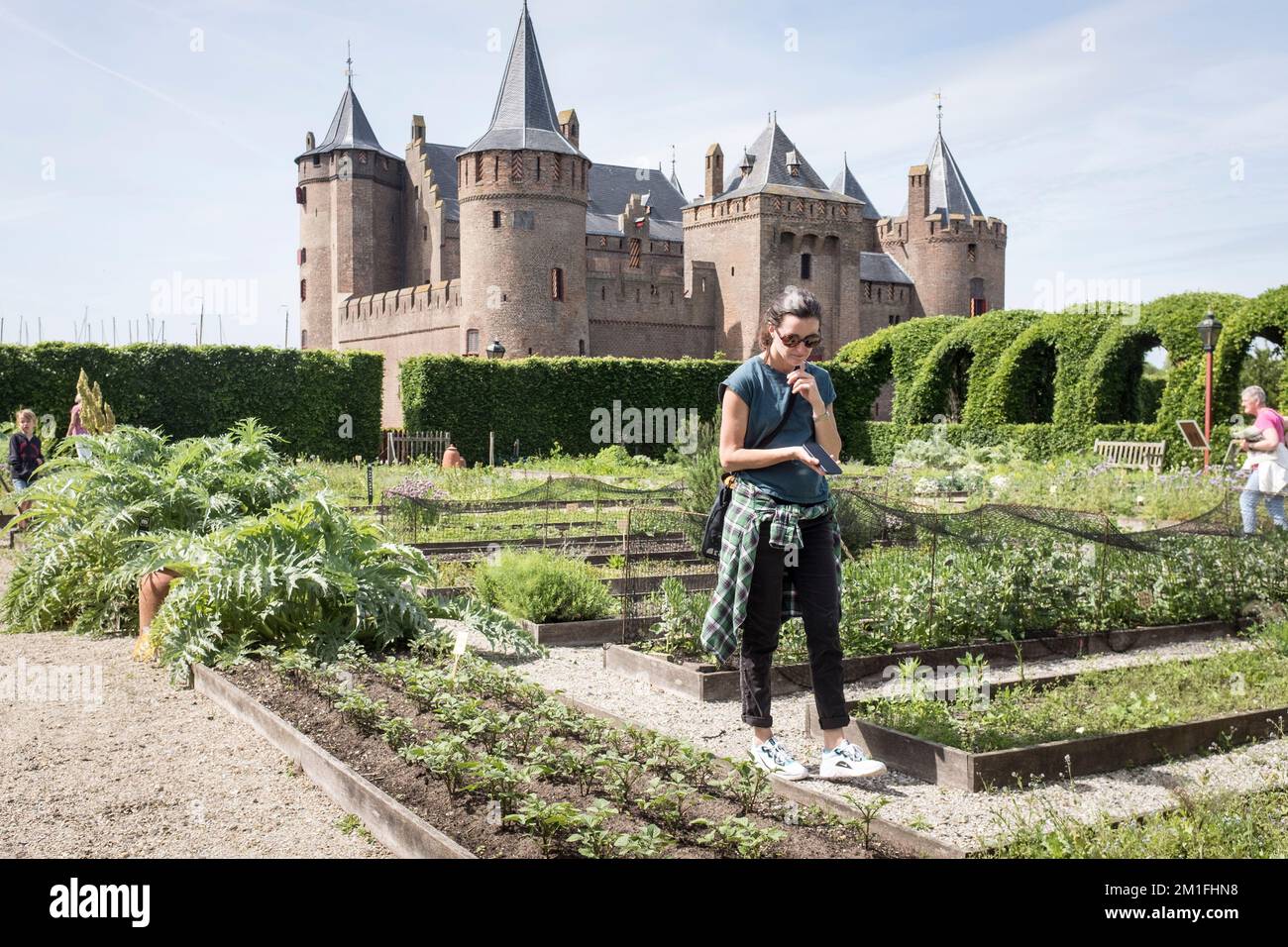 Visitors take an audio tour of the 17th century gardens within the ...