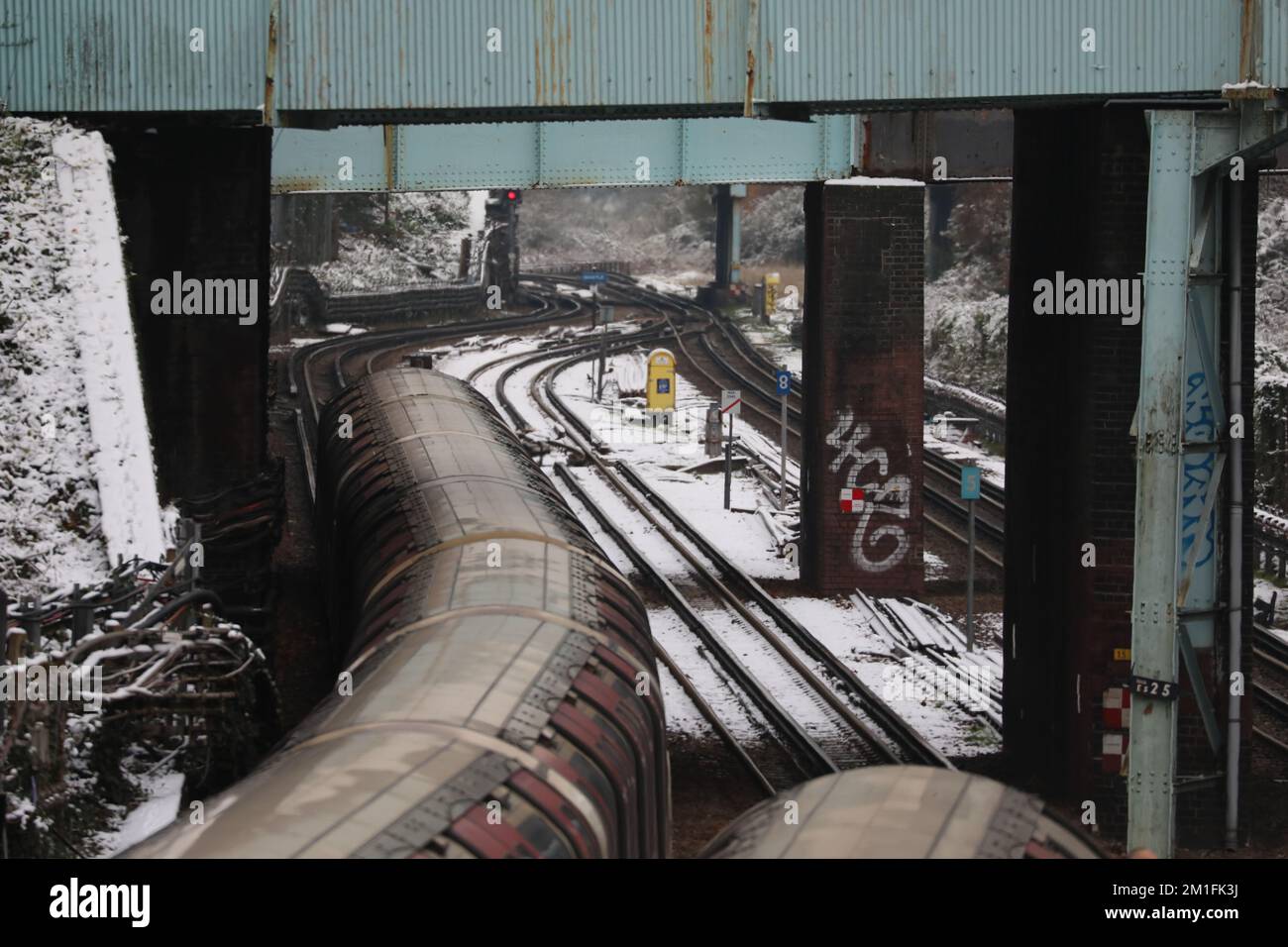 The train tracks are covered with snow at North Acton Underground ...
