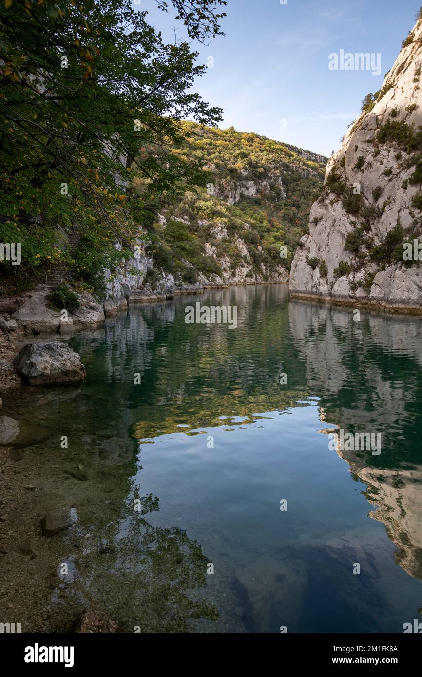 Verdon river surrounded by medium cliffs in autumn,vertical shot, Lower ...