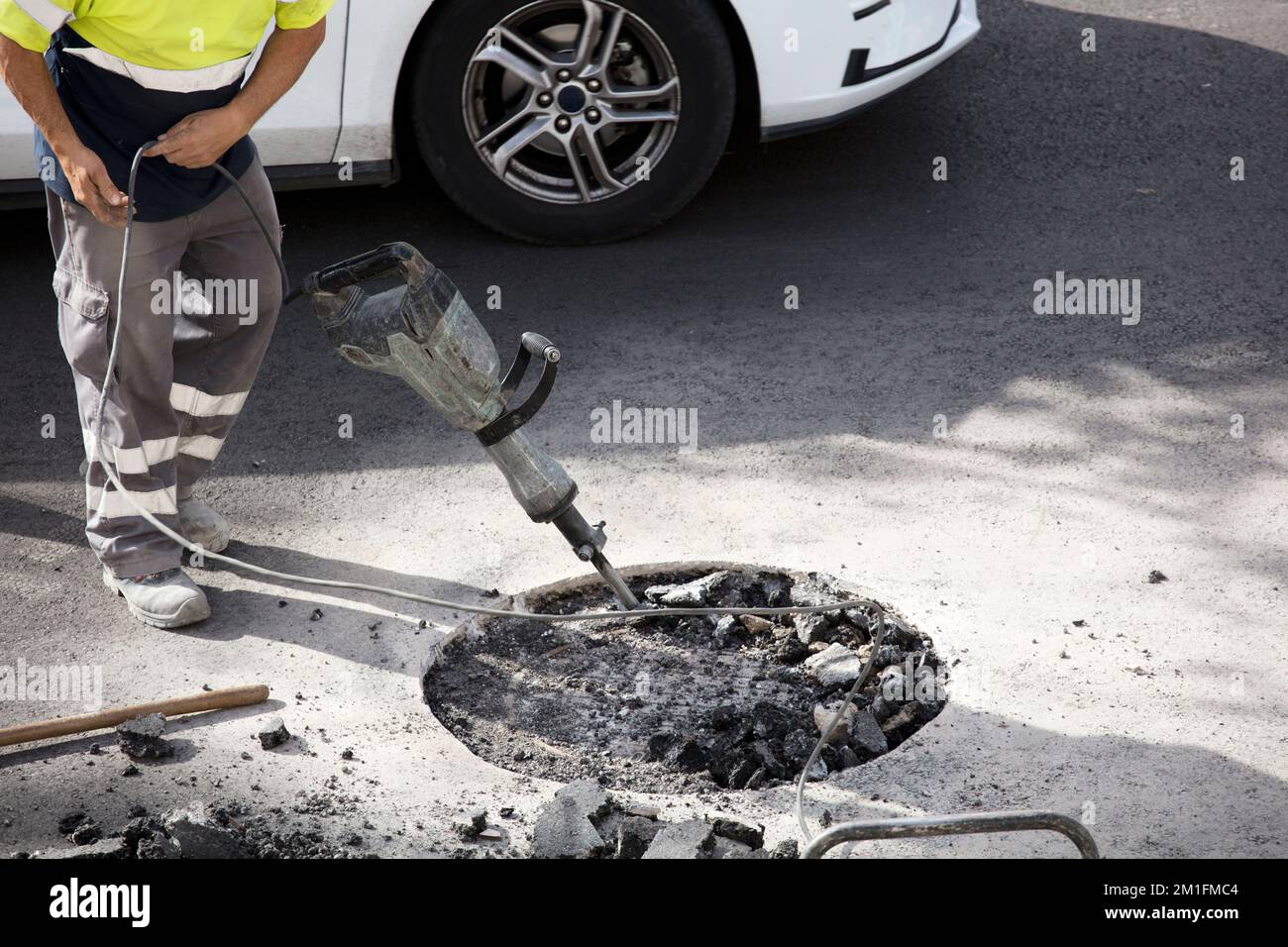 operator in uniform finishes work process with hammer, electric records ...