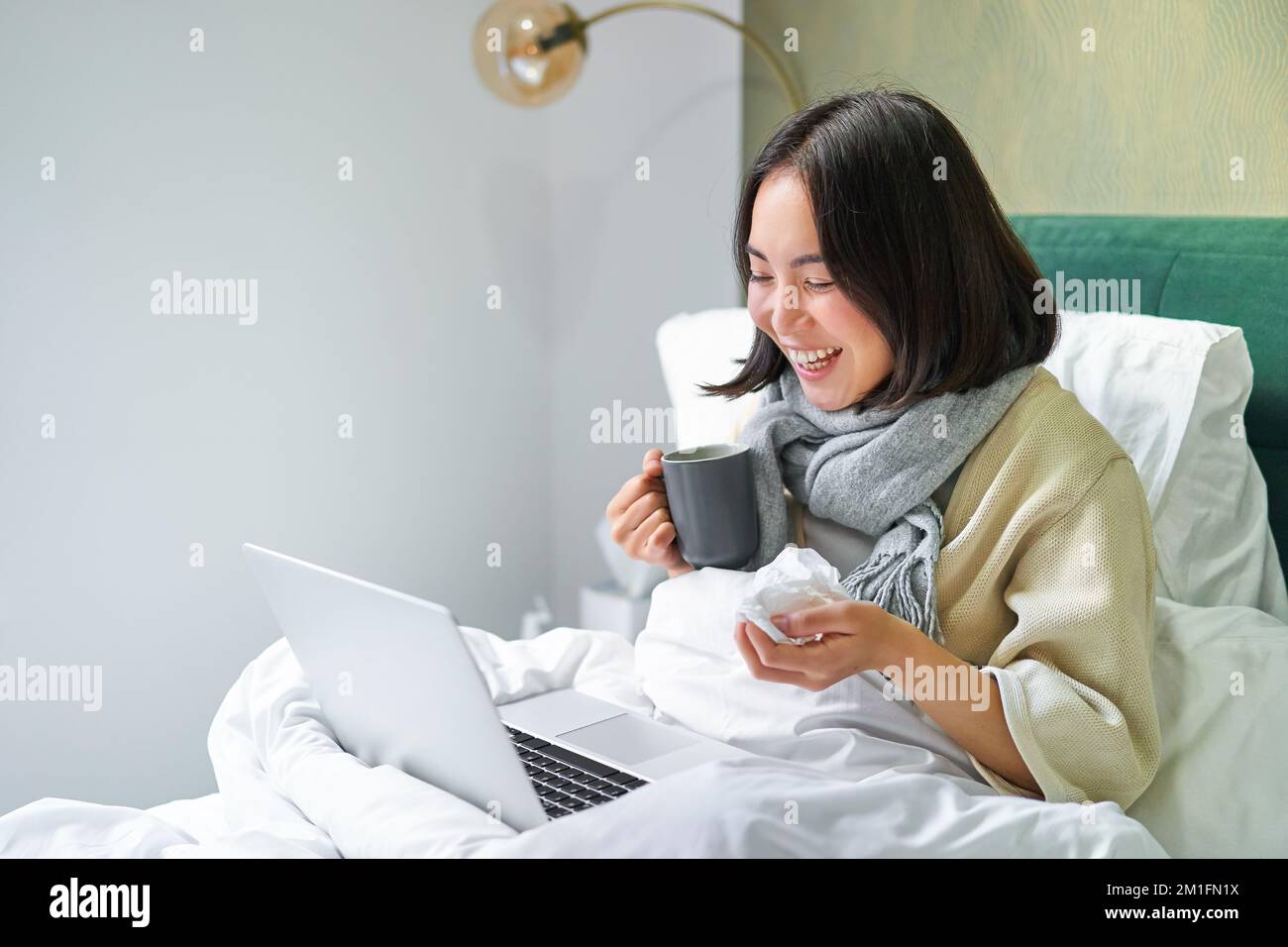 Portrait of asian sick girl, lying in bed with cold, having flu ...