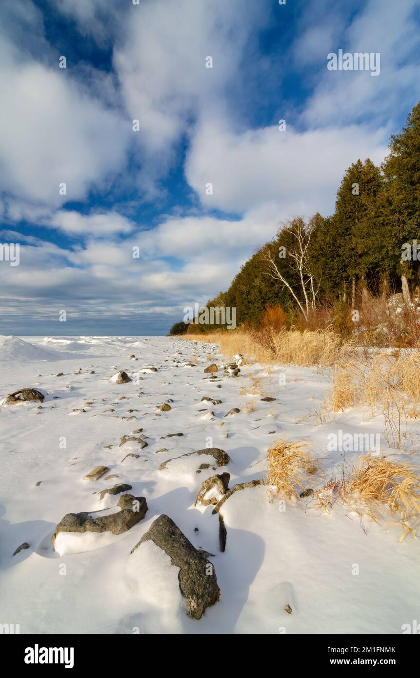 Snow covers the Green Bay shoreline in Peninsula State Park, Door ...
