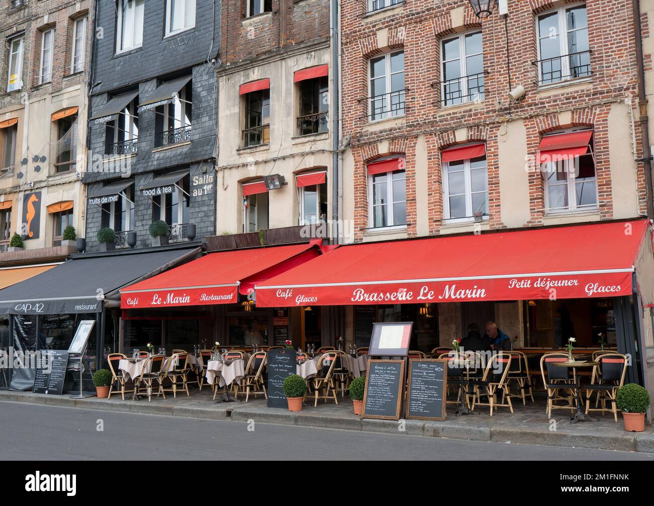 Harbourside Restaurants, with pavement seating and coloured canopies ...