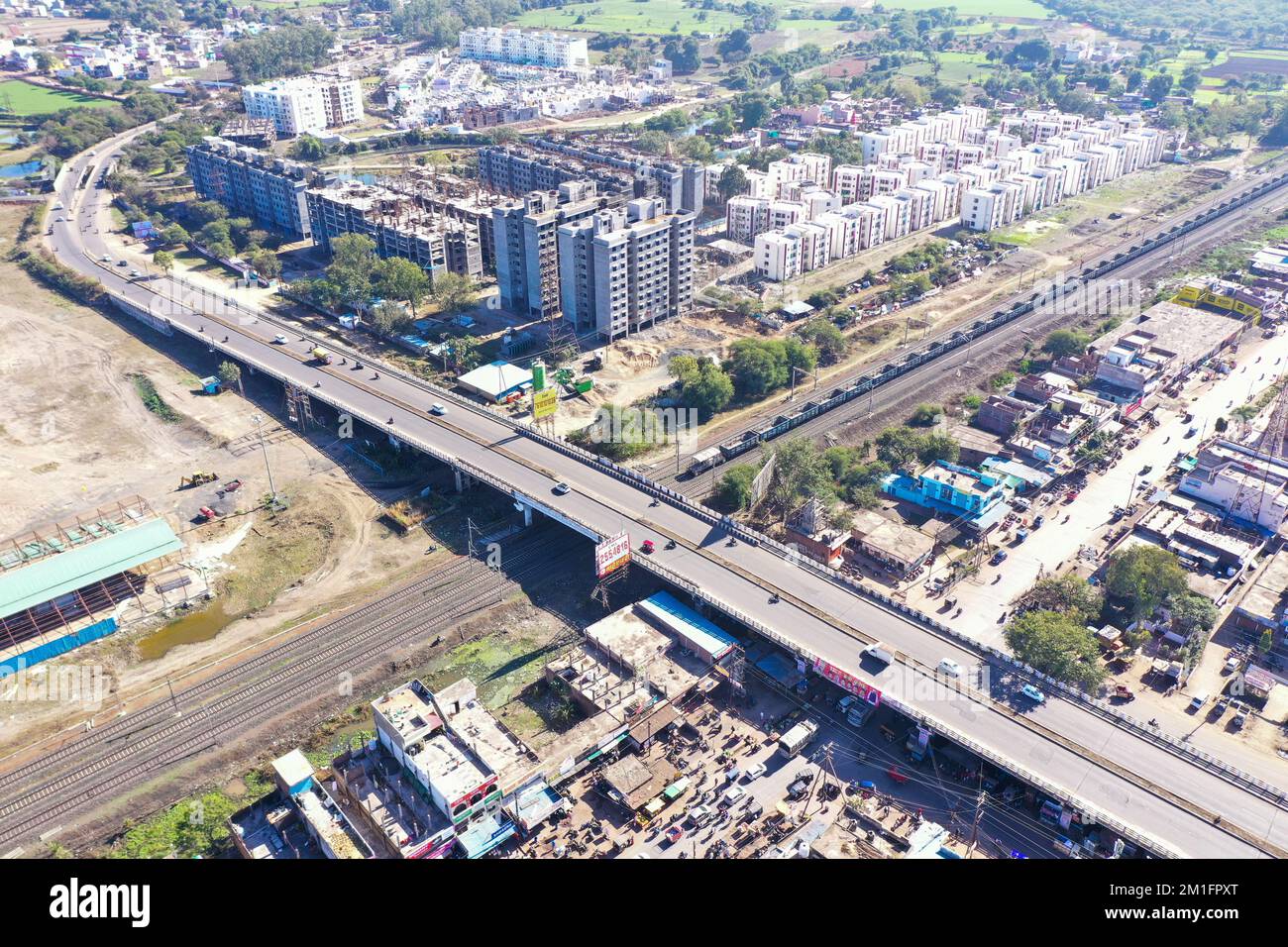 Aerial View of railway tracks and urban developments at the outskirts ...