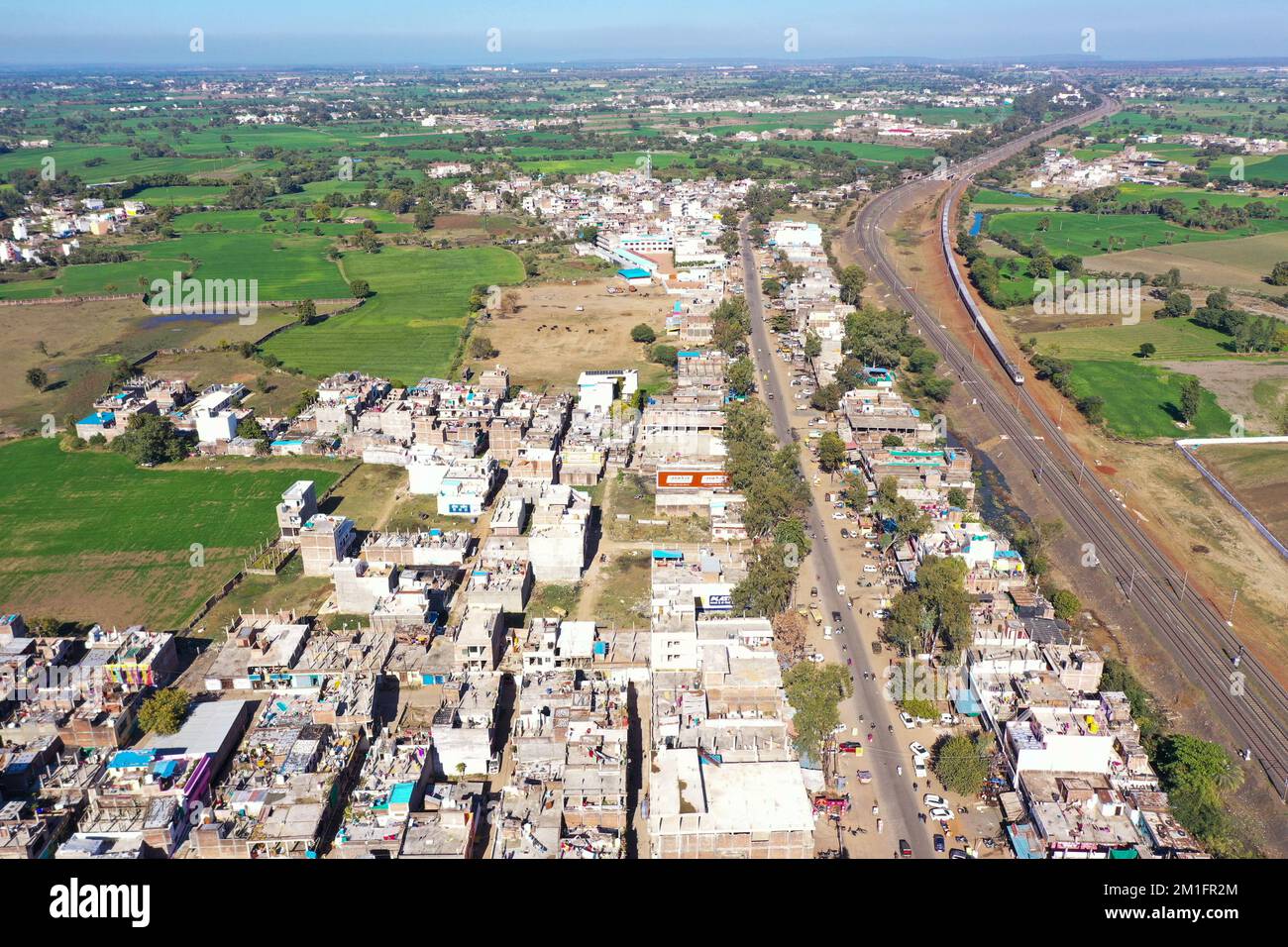Aerial View of railway tracks and urban developments at the outskirts ...