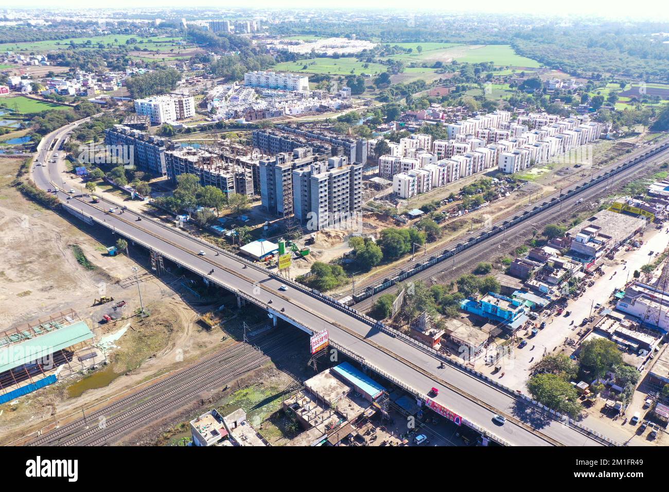 Aerial View of railway tracks and urban developments at the outskirts ...