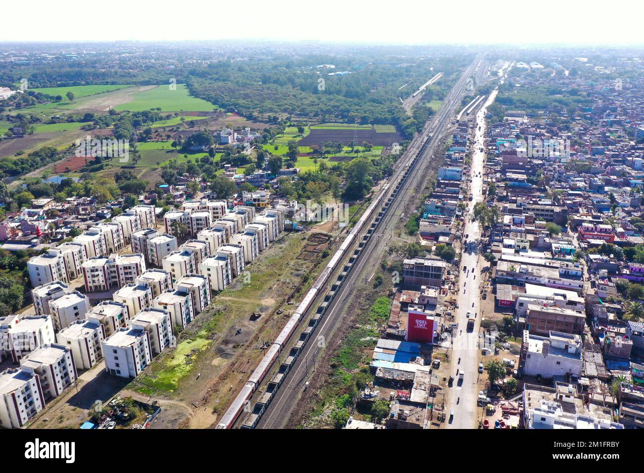 Aerial View of railway tracks and urban developments at the outskirts ...