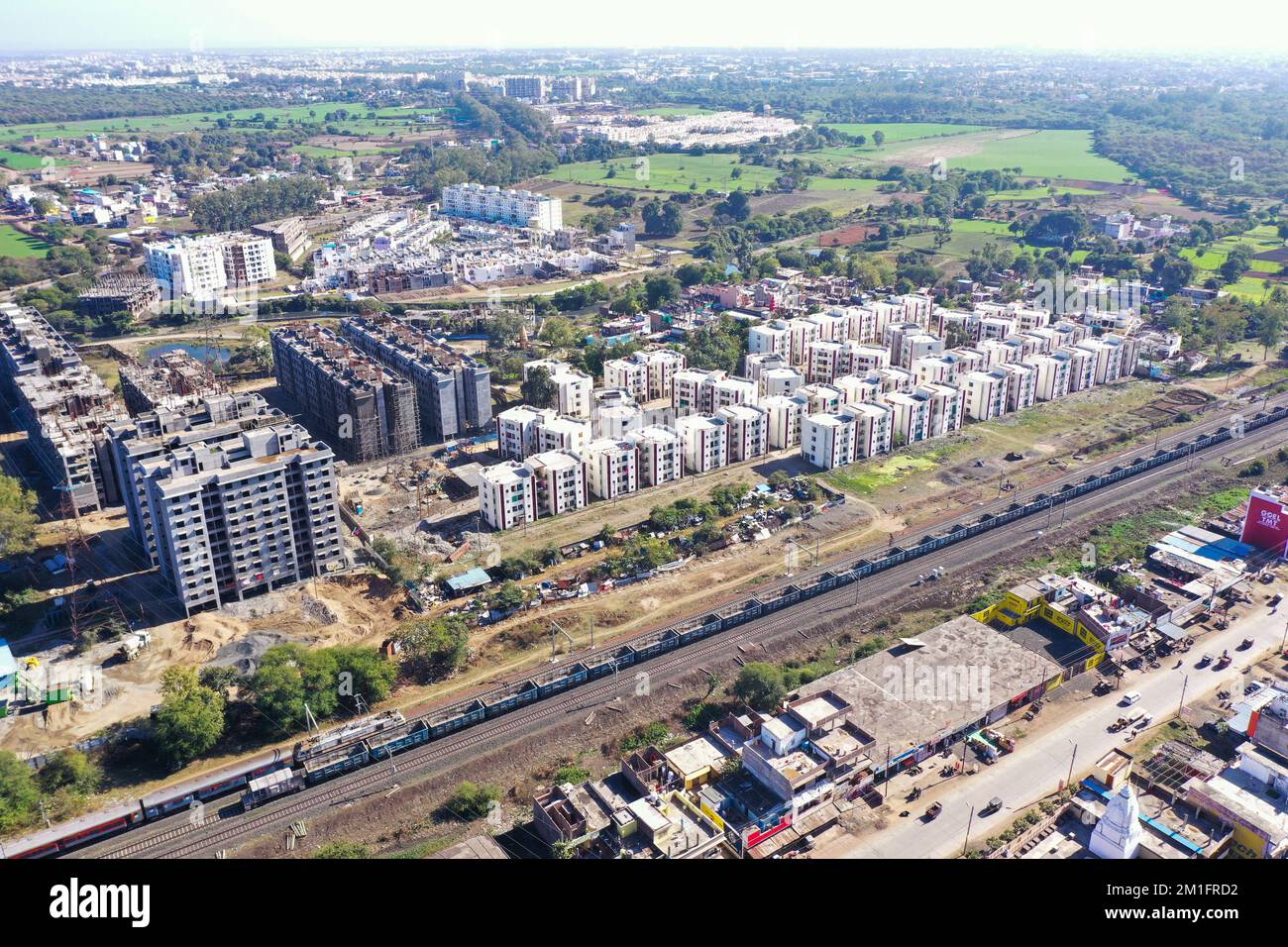 Aerial View of railway tracks and urban developments at the outskirts ...