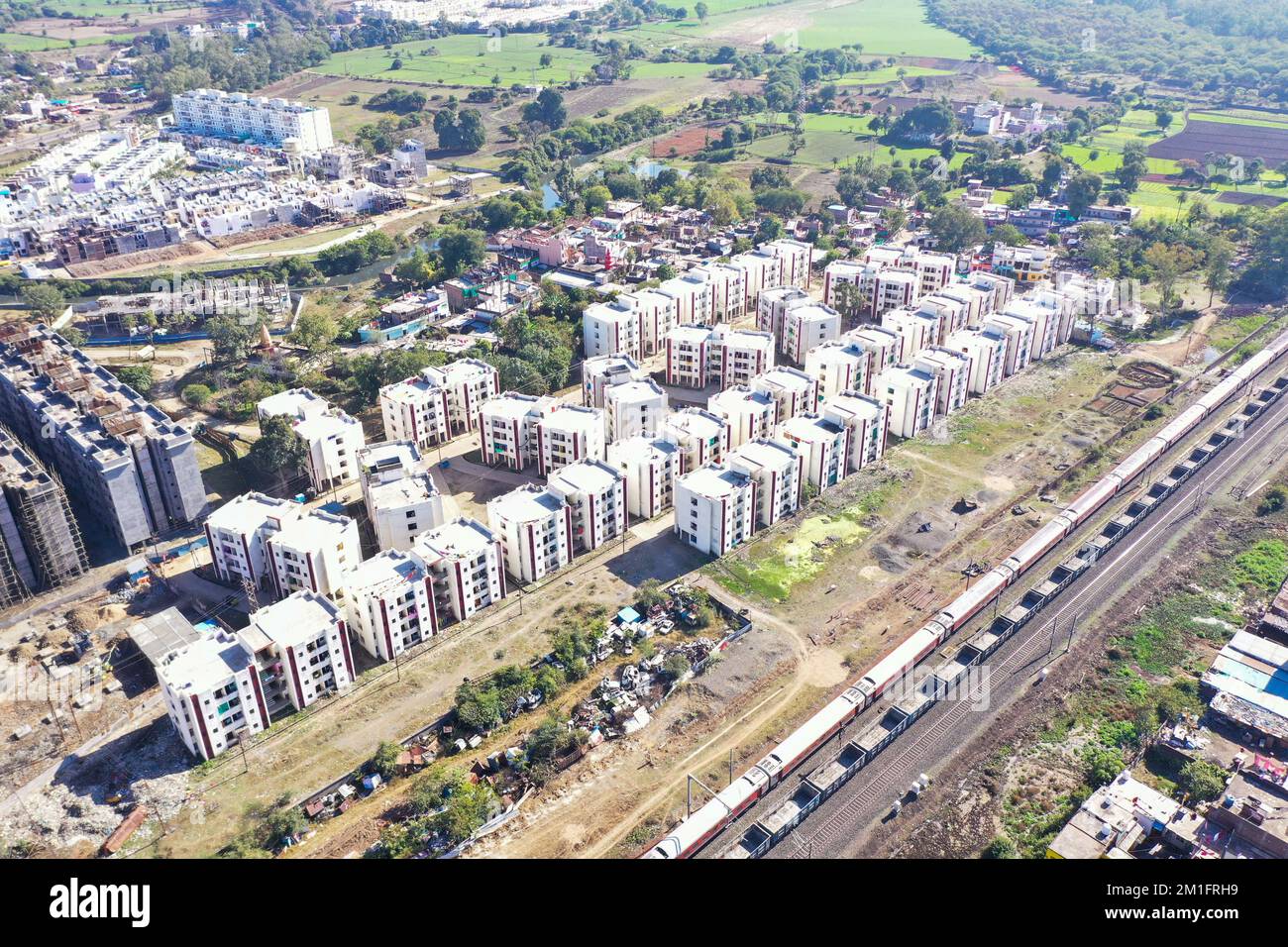 Aerial View of railway tracks and urban developments at the outskirts ...